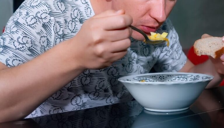 Adam came out of the bathroom, walked into the kitchen and sat down on ...